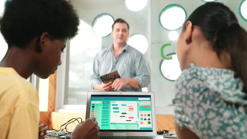 Smart Teacher Hold Tablet while Back View Student Learning Code. Edification Stock Footage ...