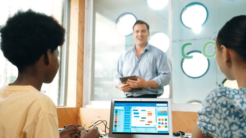 Smart Teacher Hold Tablet while Back View Student Learning Code ...