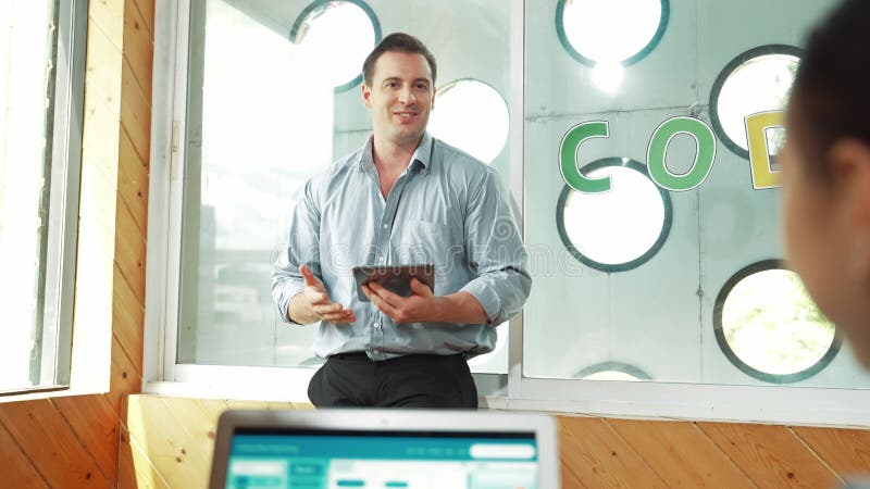 Smart Teacher Hold Tablet while Back View Student Learning Code. Edification Stock Video - Video ...