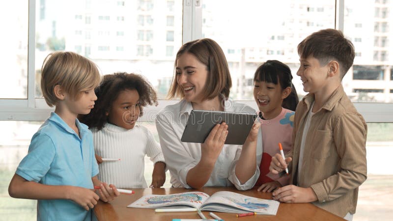 Teacher Holding Tablet while Open Online Lesson To Group of Students ...