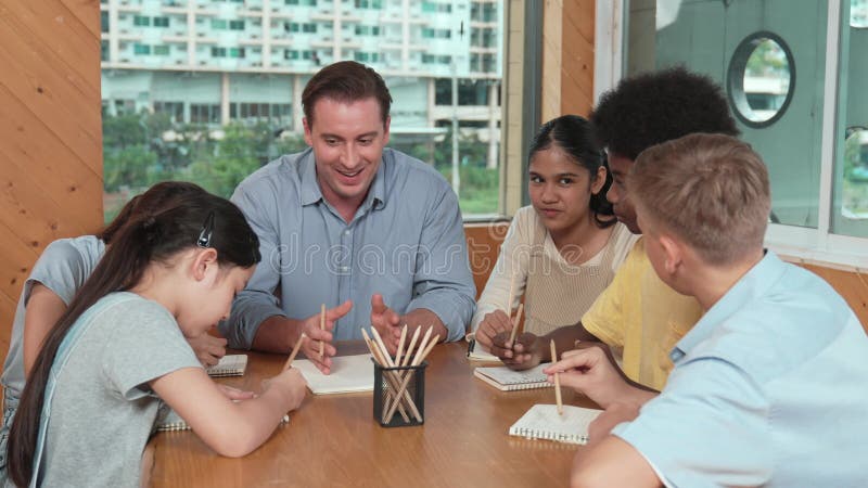 Teacher Talking and Explain Work while Children Drawing in Paper ...