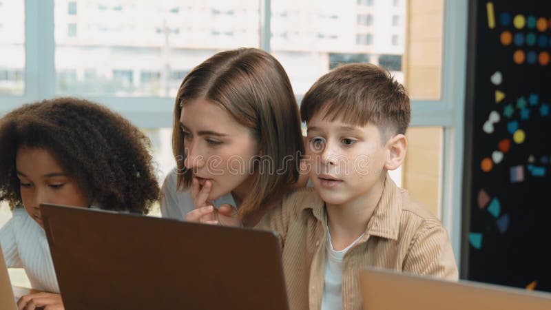 Smart Teacher Teaching and Looking Student Using Laptop at Classroom ... Smart Teacher Teaching and Looking Student Using Laptop at Classroom ...