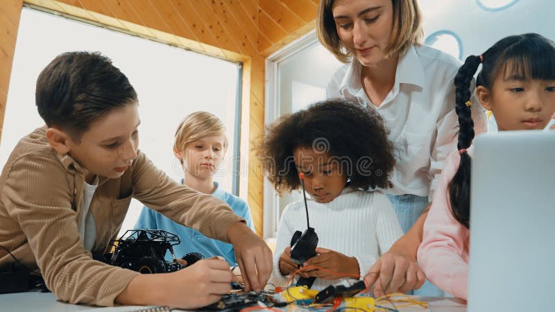 Smart Teacher Teaching Students about Car Model or Electrical Tool ...
