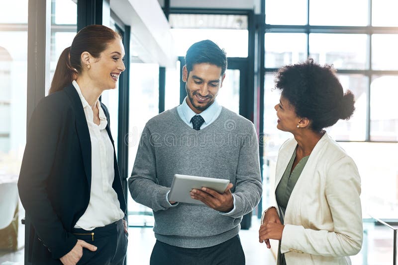 Smart Technology for a Smart Team. a Diverse Group of Young Colleagues ...