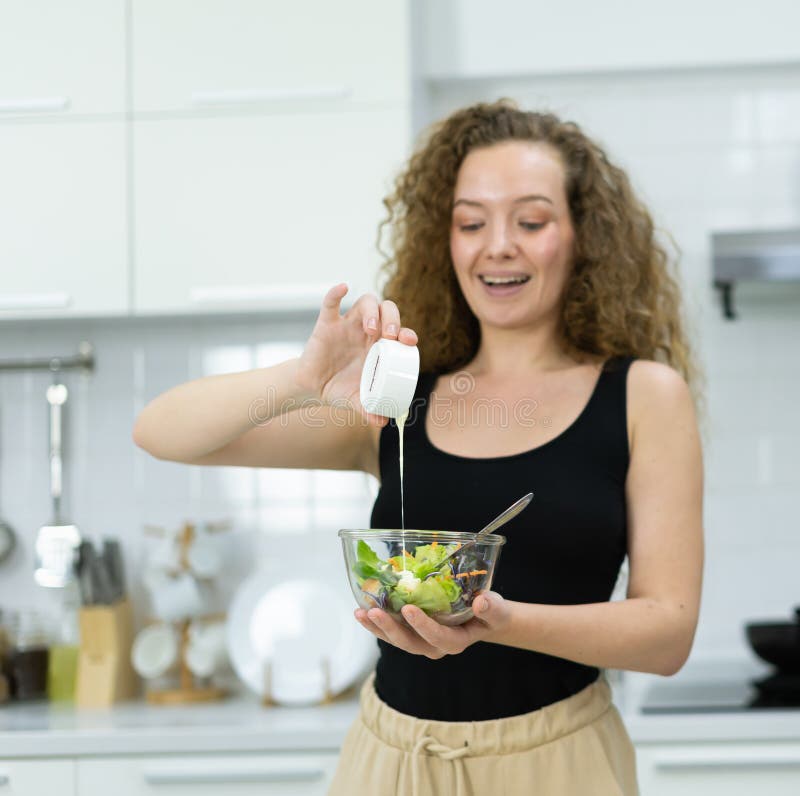 Smart Vegetarian Woman Smile Happy Pour Salad Sauce In Vegetable Cup