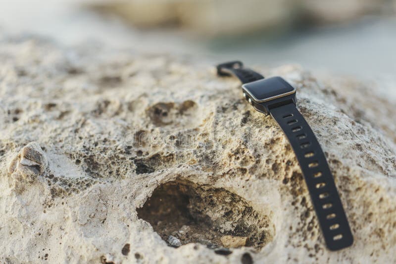 Smart watch on rock stock image. Image of face, activity - 141452597