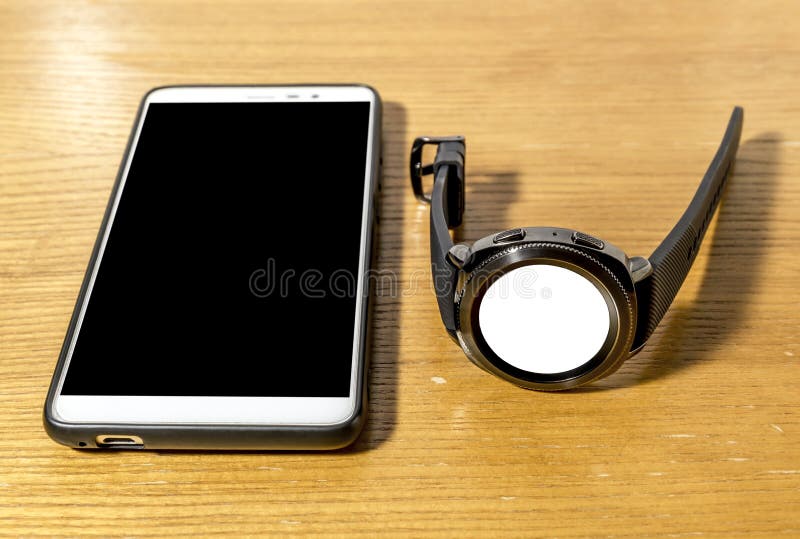 Smart Watch and Smartphone are on the Table Stock Image - Image of ...