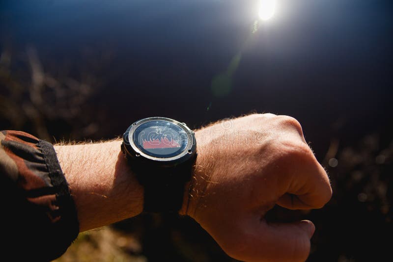 Smart Watch with Temperature Graph on the Screen Against Sunrise Lake ...