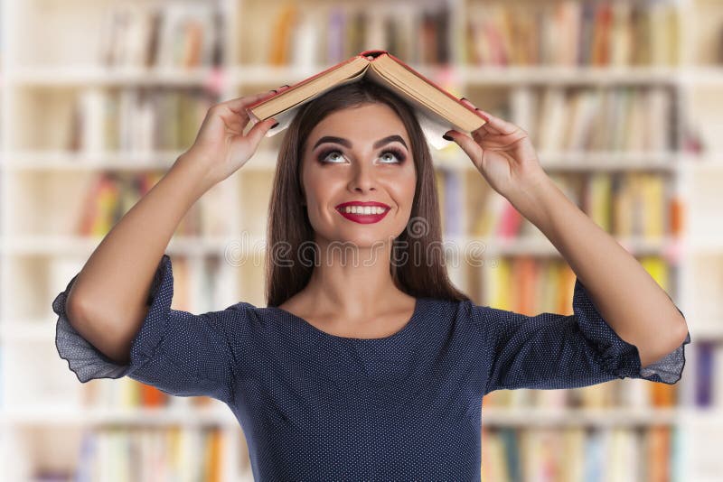 Smart woman with books stock photo. Image of female, library - 82955106