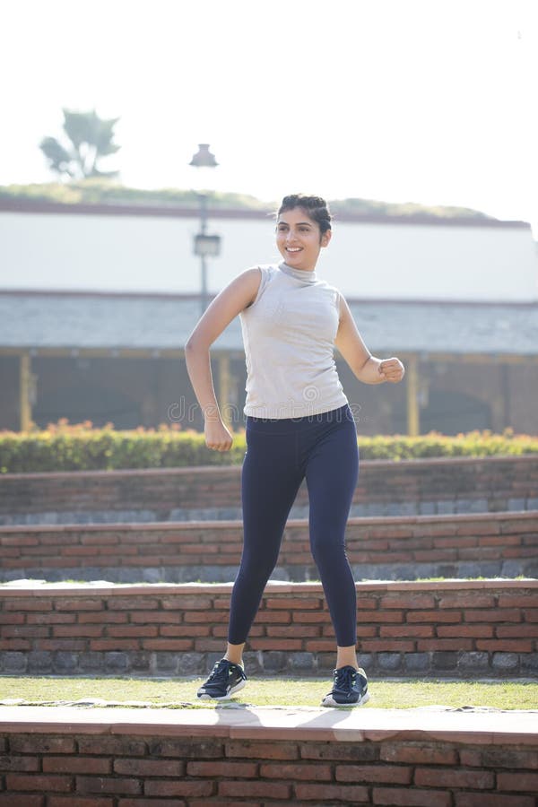 Smart Woman Doing Standing Cross Crunches Exercise Stock Photo - Image ...