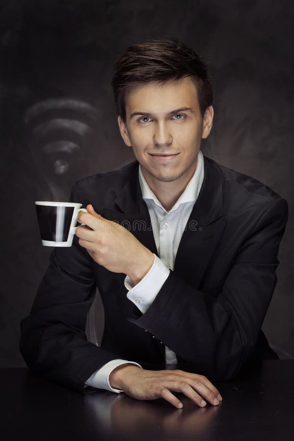 Smart Young Businessman Holding the Cup of Vaporous Coffee Stock Image ...