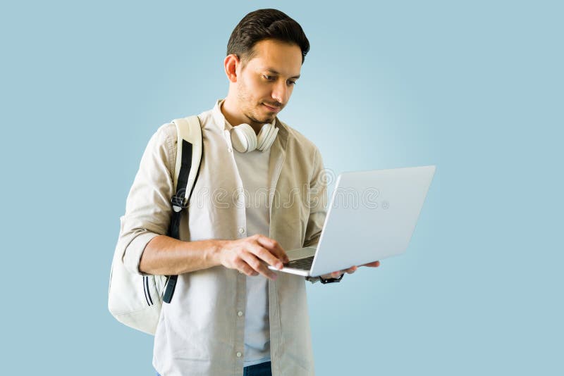 Smart Young Man Using His Laptop Stock Image - Image of homework ...