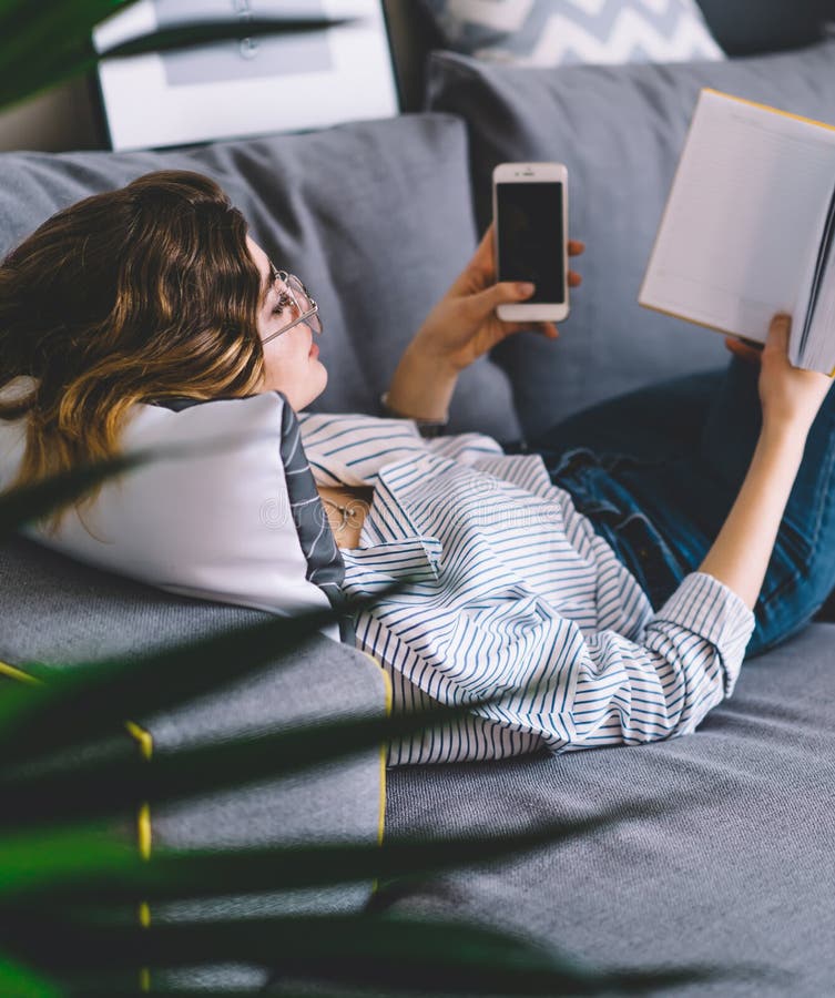 Smart Young Woman Lying on Cozy Couch Stock Photo - Image of female ...