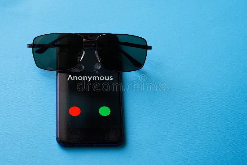 A Smartphone with an Anonymous Call Lies on a Blue Surface Next To ...