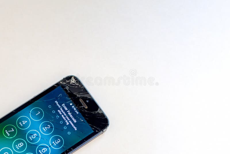 Smartphone with Badly Smashed Screen is Showing Apple Logo while ...