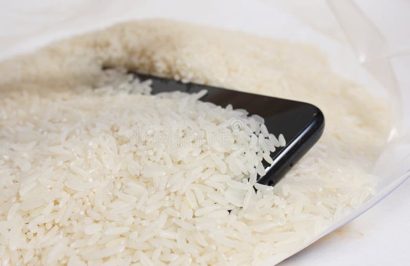Smartphone in Bag of Rice To Remove Water Stock Photo - Image of ...