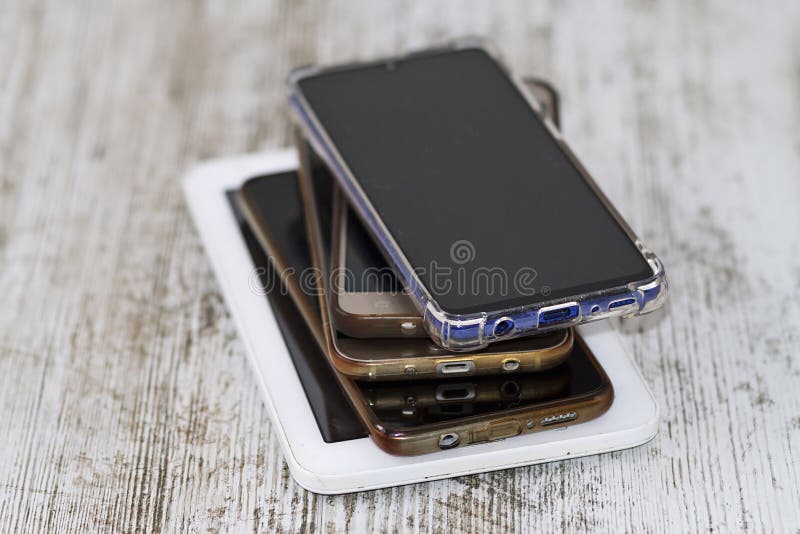 Smartphones pile and cable stock photo. Image of cable - 252565972