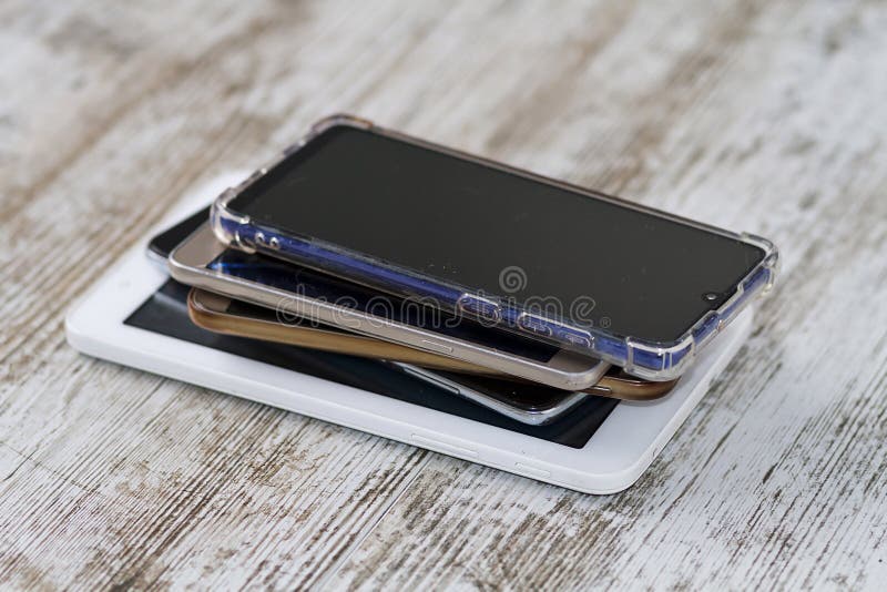Smartphones pile and cable stock image. Image of lifestyle - 252566009