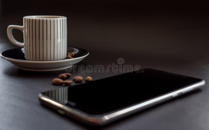 Smartphone Besides Coffee on Dark Leather Surface Stock Image - Image ...