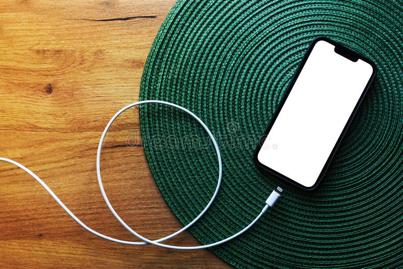 Smartphone with Blank Mockup Screen and Mobile Charger Cable on the ...