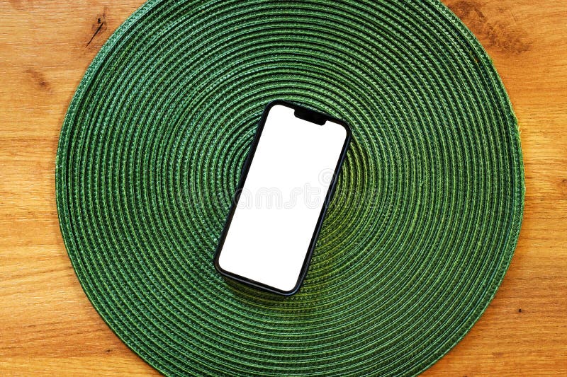 Smartphone with Blank Mockup Touch Screen on Green Plastic Table Mat ...