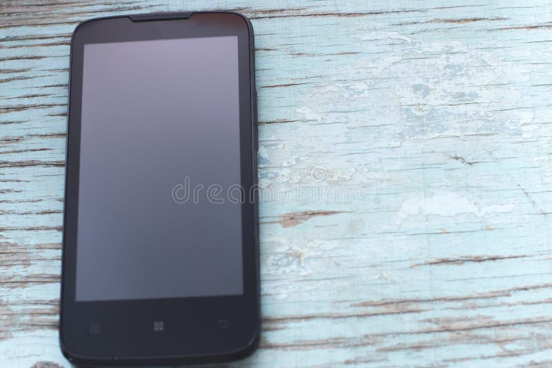 Smartphone on a blue board stock photo. Image of energy - 85162594
