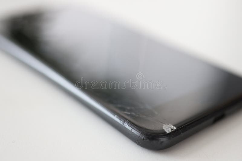 Smartphone with Broken Front Screen is Lying on Table Closeup Stock ...