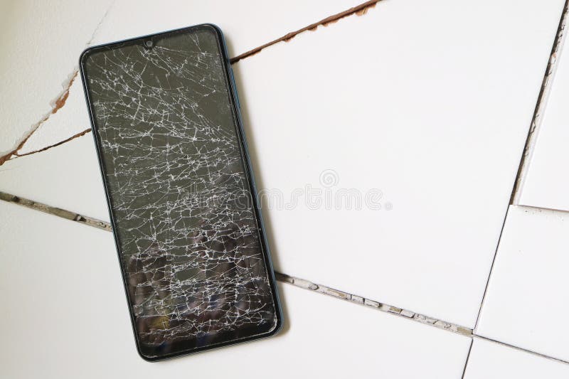 Smartphone with Broken Screen on Cracked Floor Stock Photo - Image of ...