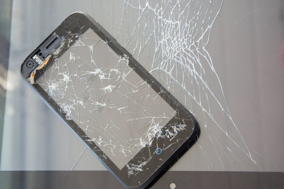 A Smartphone with a Broken Screen and a Tablet Computer with a Broken ...