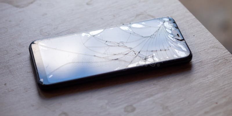 Smartphone with Broken Touchscreen Screen on Table Desktop Stock Image ...