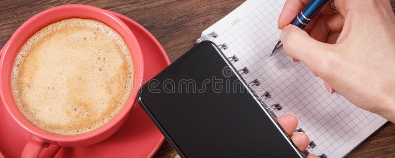 Smartphone, Coffee with Milk and Hand of Woman Writing Notes in Notepad ...
