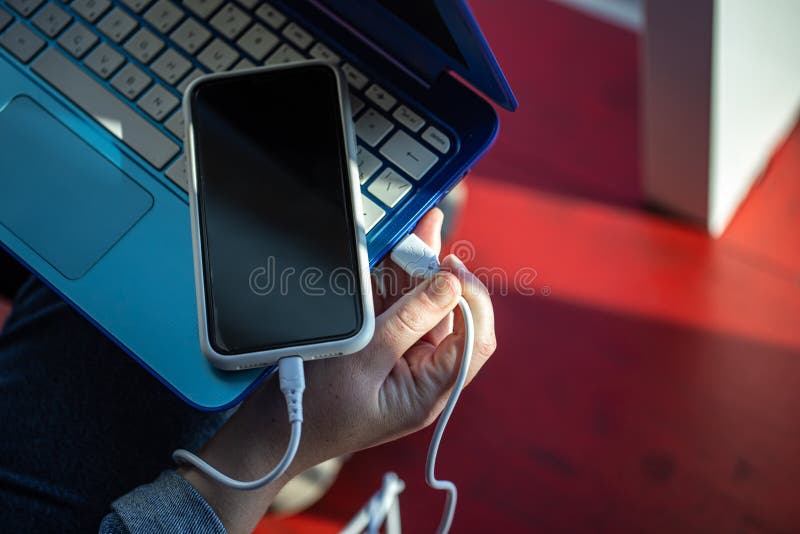 The Smartphone is Connected To the Laptop Via USB Cable. Stock Image ...