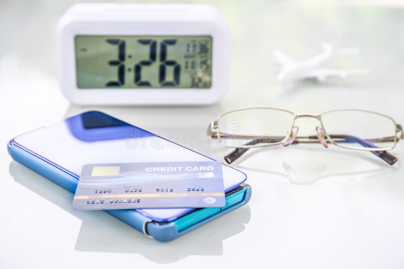 Smartphone with Credit Card and Digital Clock on Deck Stock Photo ...