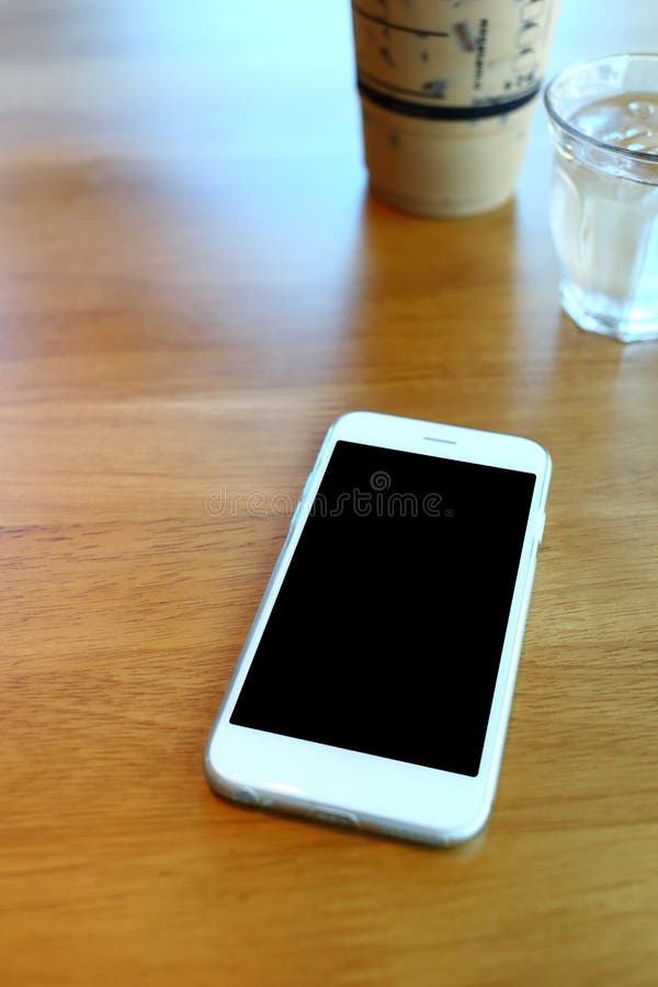 Smartphone on Desk in Coffee Cafe Stock Photo - Image of information ...