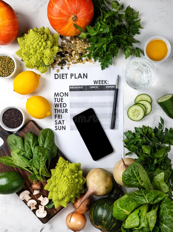 Diet Plan and Set of Fruits and Vegetables on the Table. Top View Stock ...