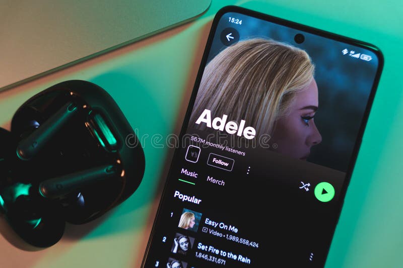 A Smartphone Displaying Adele S Artist Profile on Spotify Editorial ...