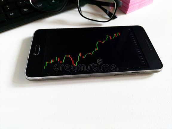 Smartphone Displaying a Chart with a Stack of Indonesian Rupiah ...