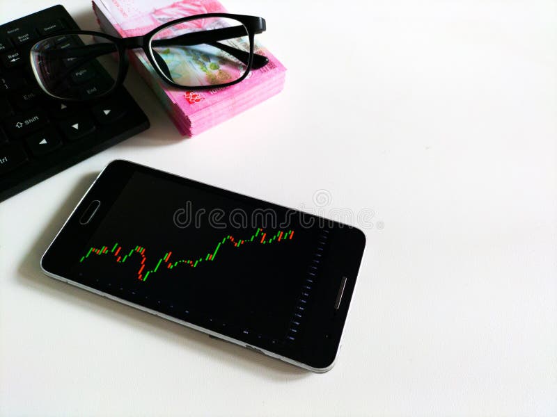 Smartphone Displaying a Chart with a Stack of Indonesian Rupiah ...