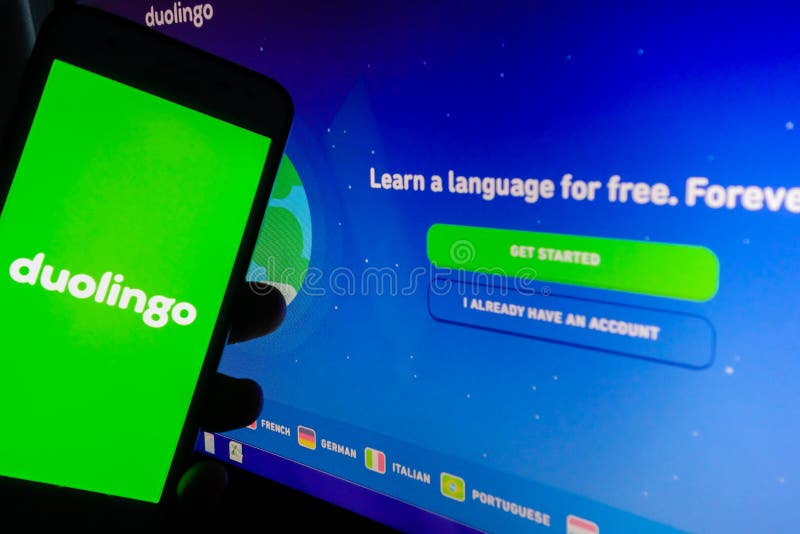 Smartphone with Duolingo Language App Logo on Screen. Blurred ...