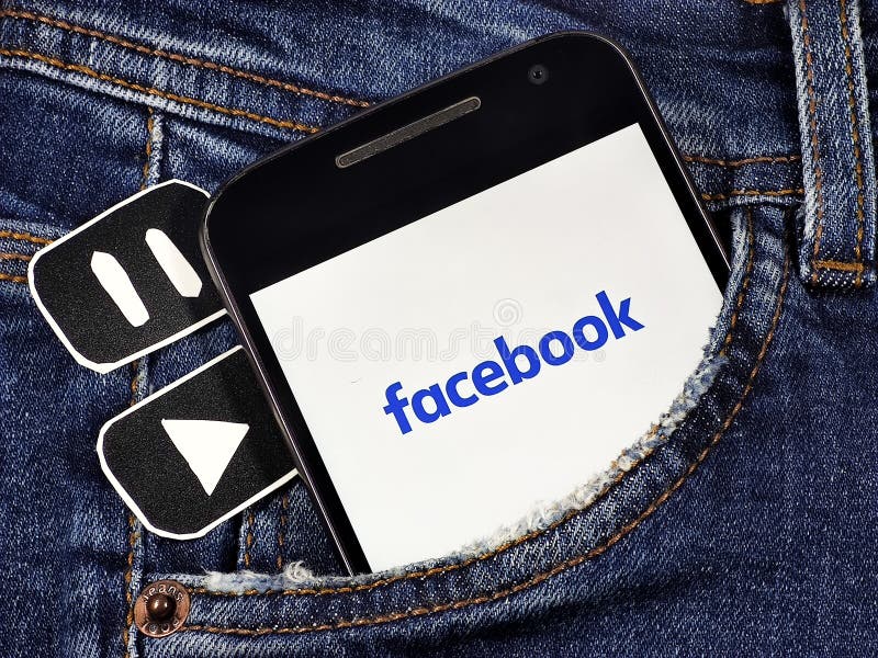 Smartphone with Facebook App on the Screen in Jeans Pocket with Pause ...