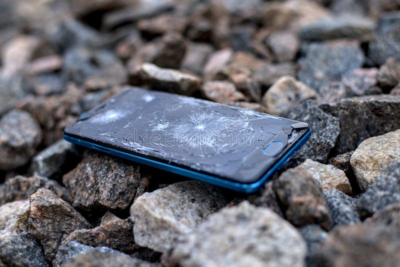 The Smartphone Fell on Gravel and Rocks and Broke. Stock Photo - Image ...