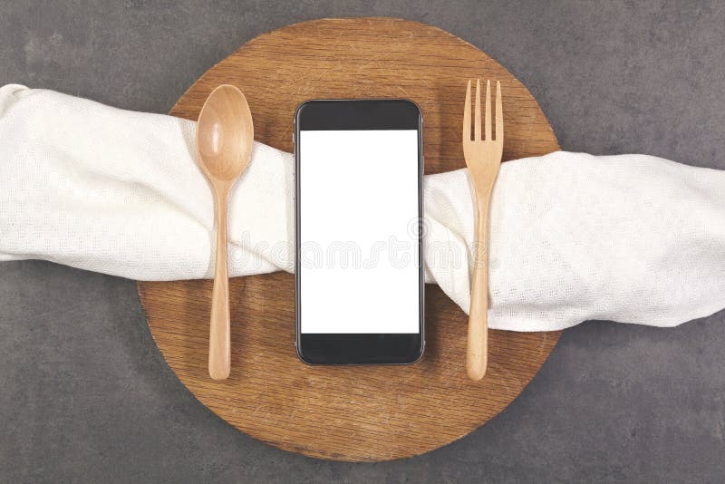 Smartphone with Fork and Spoon on Wooden Board. Food Concept Stock ...