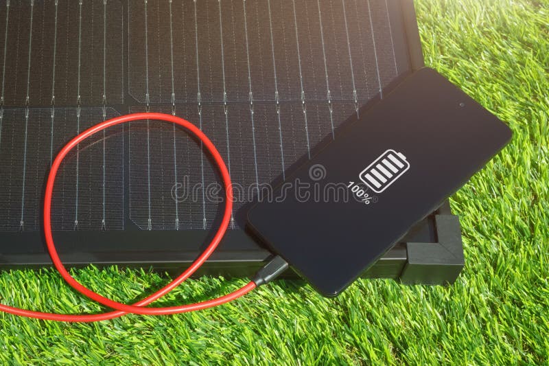 The Smartphone is Fully Charged with Solar Panel. Outdoors Electrical ...