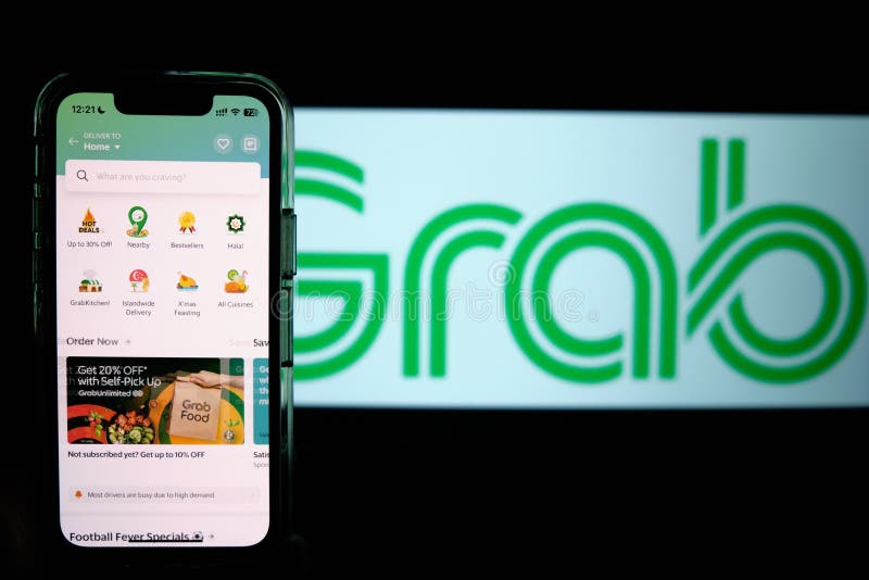 Smartphone with the Grab App in Front of Their Web Page Editorial Image ...