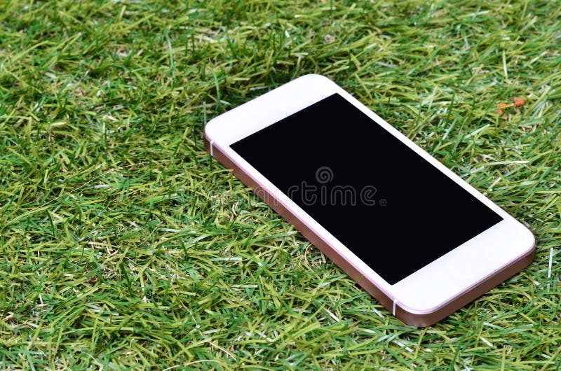 Smartphone on Grass Background Stock Photo - Image of internet, smart ...