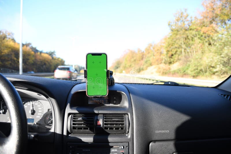 Smartphone with Green Screen in Windshield Holder in the Car for ...