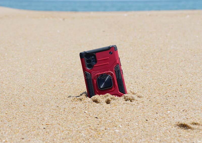 A Smartphone Half-buried in the Sand on the Beach Stock Image - Image ...