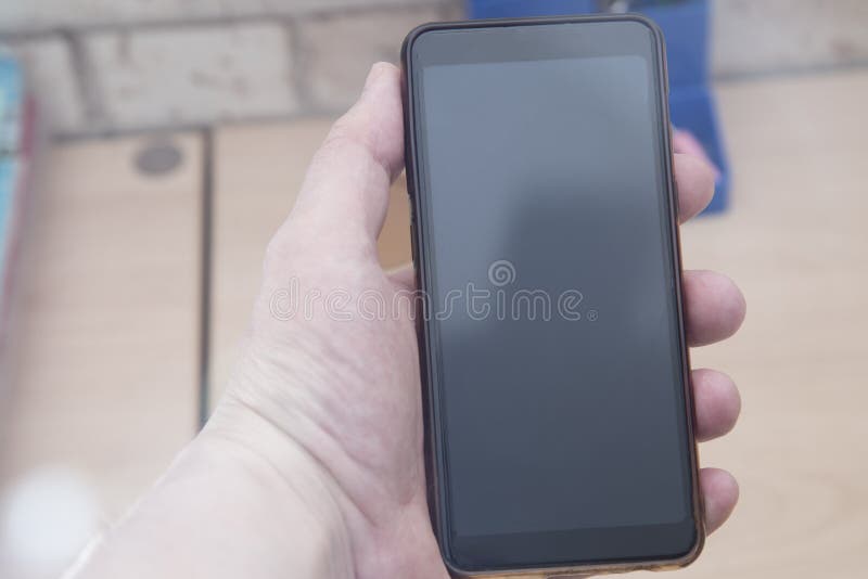 A Smartphone in the Hands of a Person.Using Your Smartphone for the ...