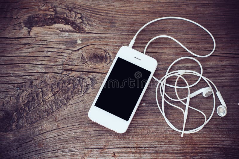 Smartphone with headphones stock photo. Image of digital - 51044404