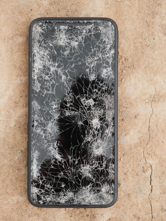The Smartphone Hit the Floor, it Fell into a Crack Stock Photo - Image ...